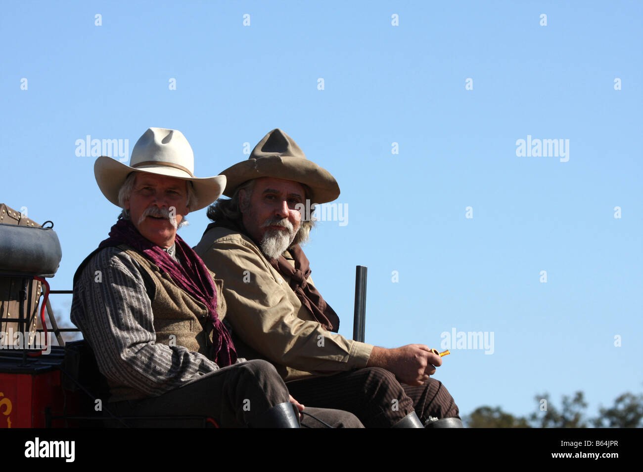 Two cowboys driving the Butterfield Overland Stage Coach Stock Photo ...