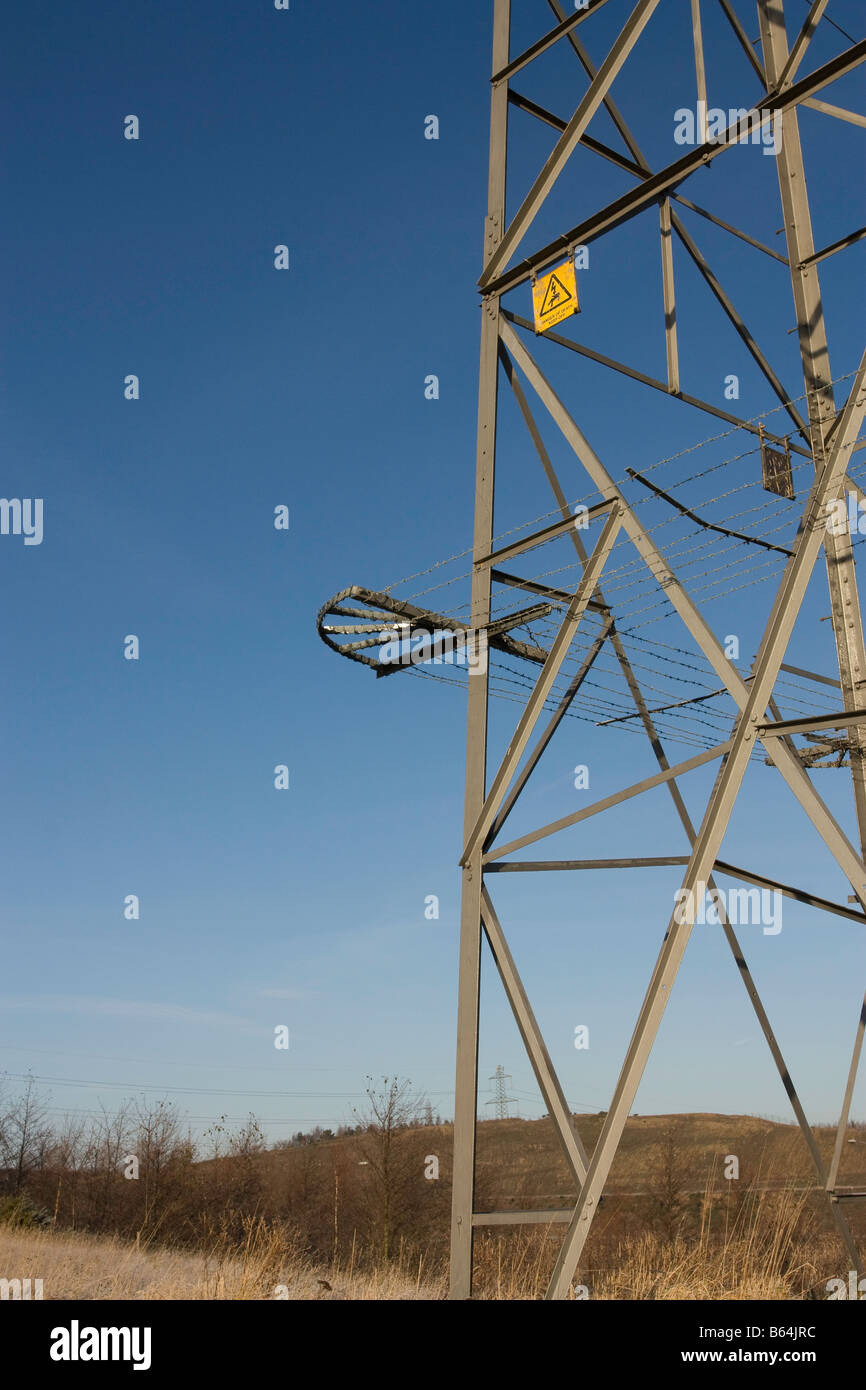 crop shot of warning sign and barbed wire to prevent unauthorised ...