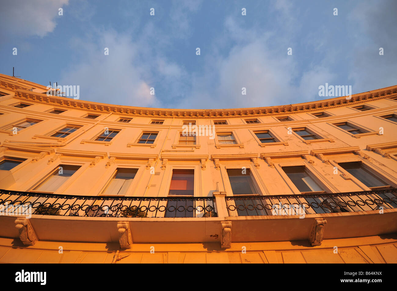 Regency style housing on the Brighton seafront at dusk, Brighton, East ...