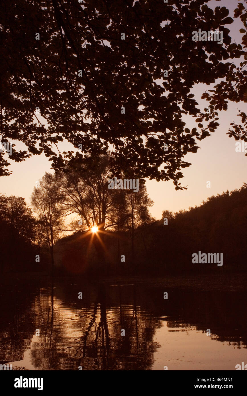 Sunset trees reservoir water ripples hi-res stock photography and ...