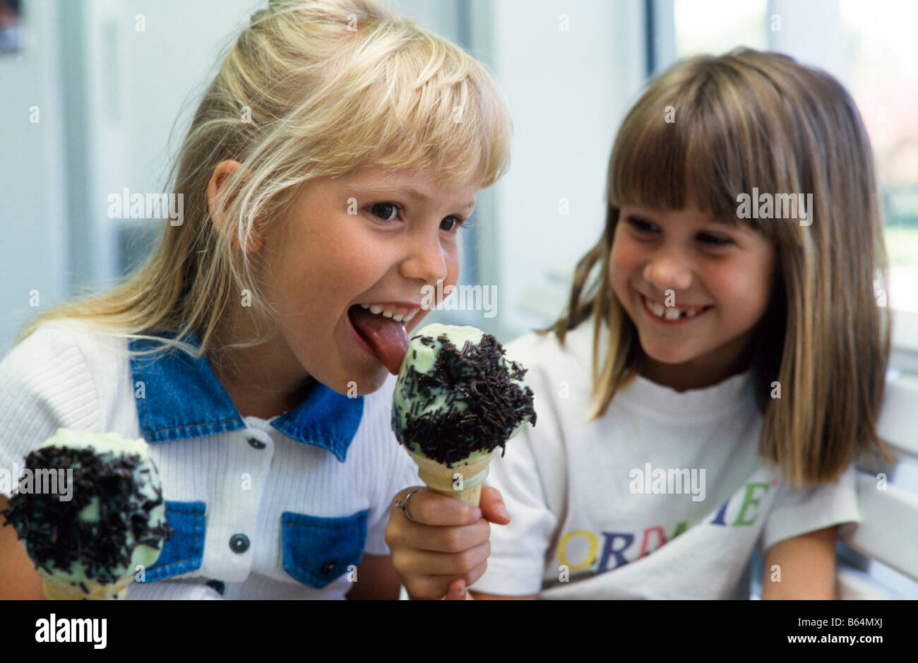 Girls eating and sharing ice cream cones, friends, friendship, Miami ...