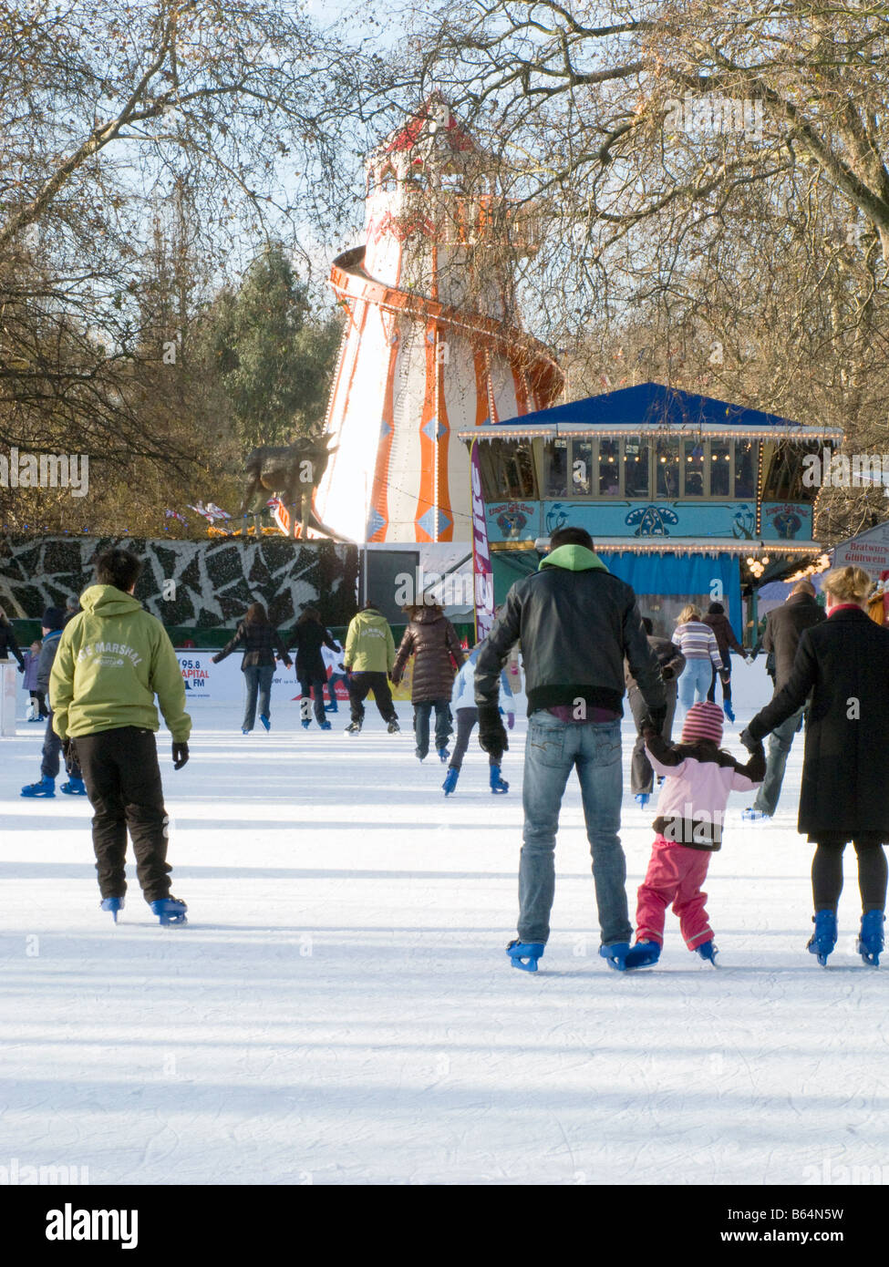 UK. Ice skating at Christmas Market in Hyde Park, London.Photo © Julio ...