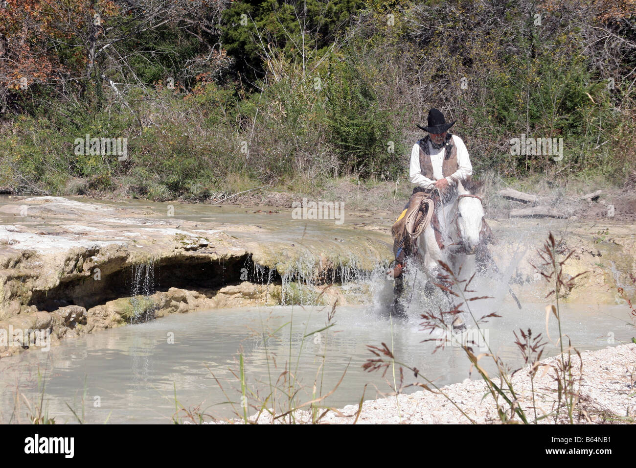 Cowboy riding horse full gallop hi-res stock photography and images - Alamy