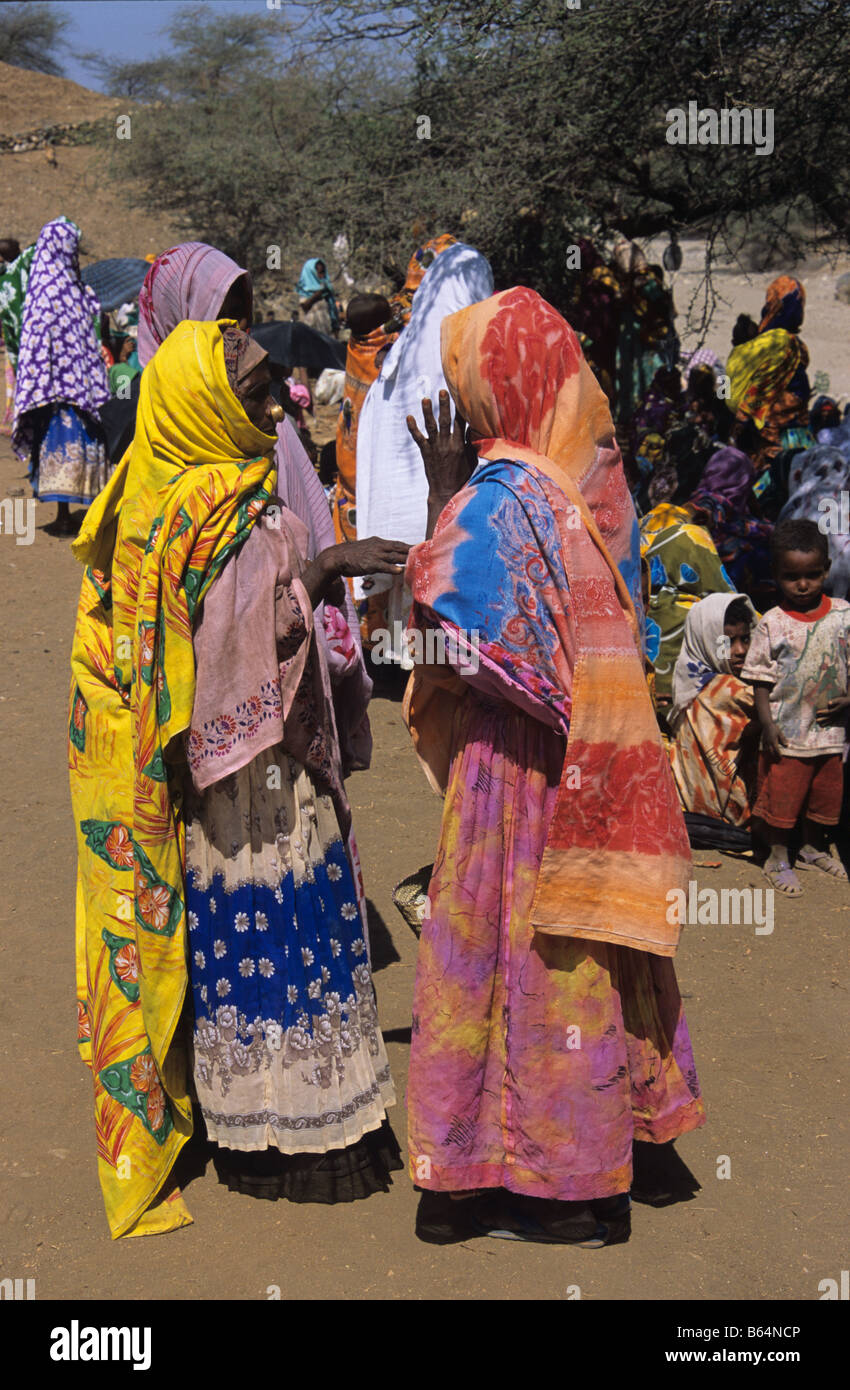 Eritrean women wait for food at a food distribution centre in the arid ...