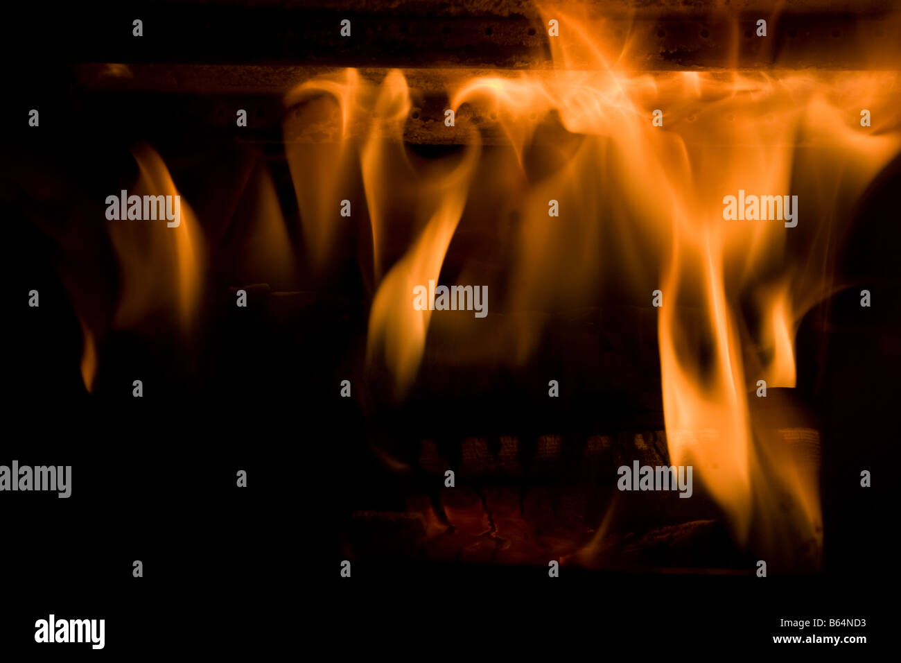 Fire burning in efficient wood stove to heat a house Stock Photo - Alamy