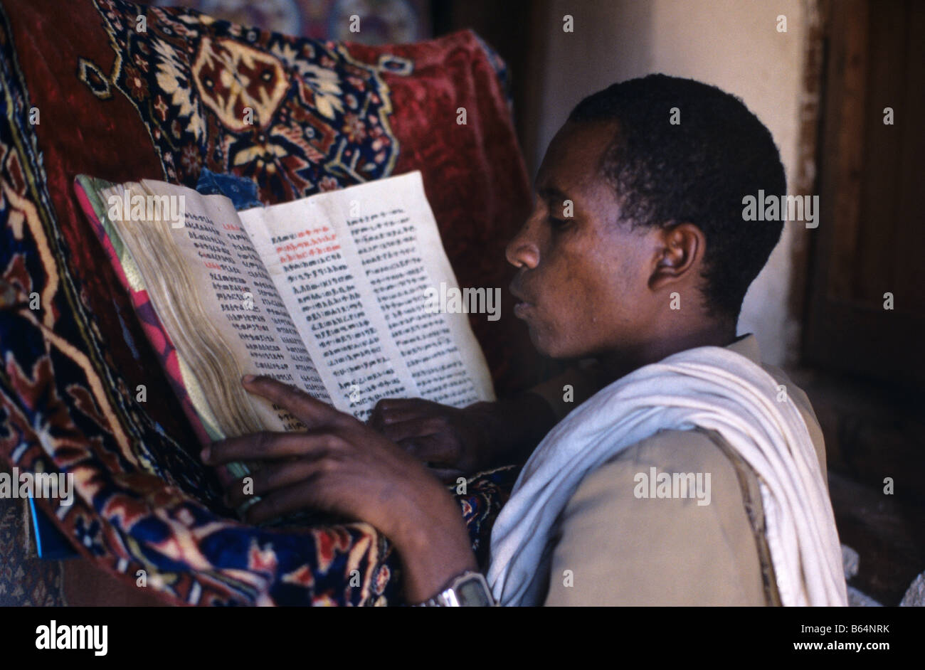 An Orthodox Coptic monk reads from holy books, Bible or scriptures at ...
