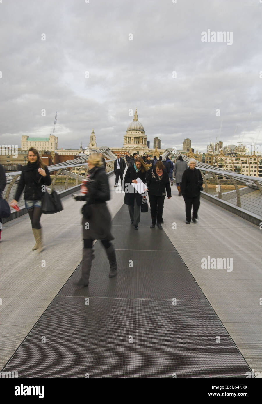 Woman crossing Millenium Bridge Stock Photo - Alamy