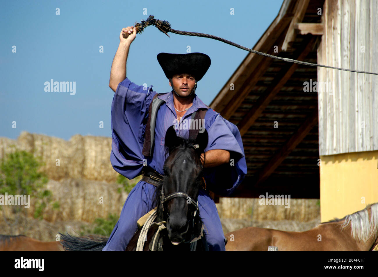 Hungary, a Chicos giving a riding and whipping demonstration at a farm ...
