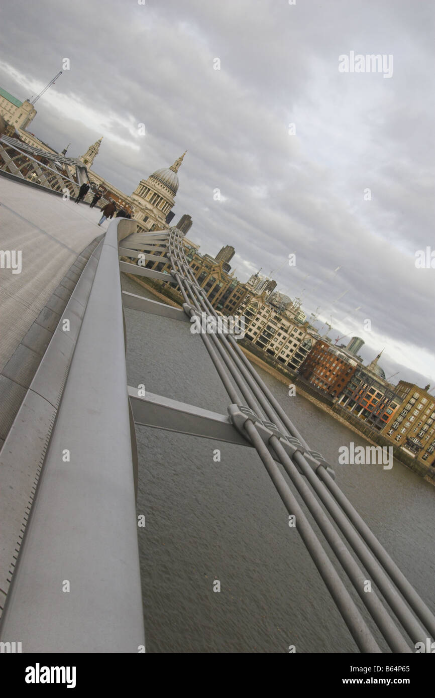 Crossing the millenium bridge hi-res stock photography and images - Alamy
