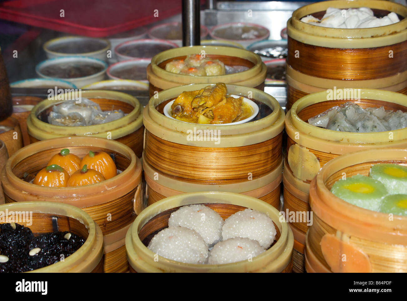 Bamboo steamer trays with dim sum choices at small restaurant in former ...