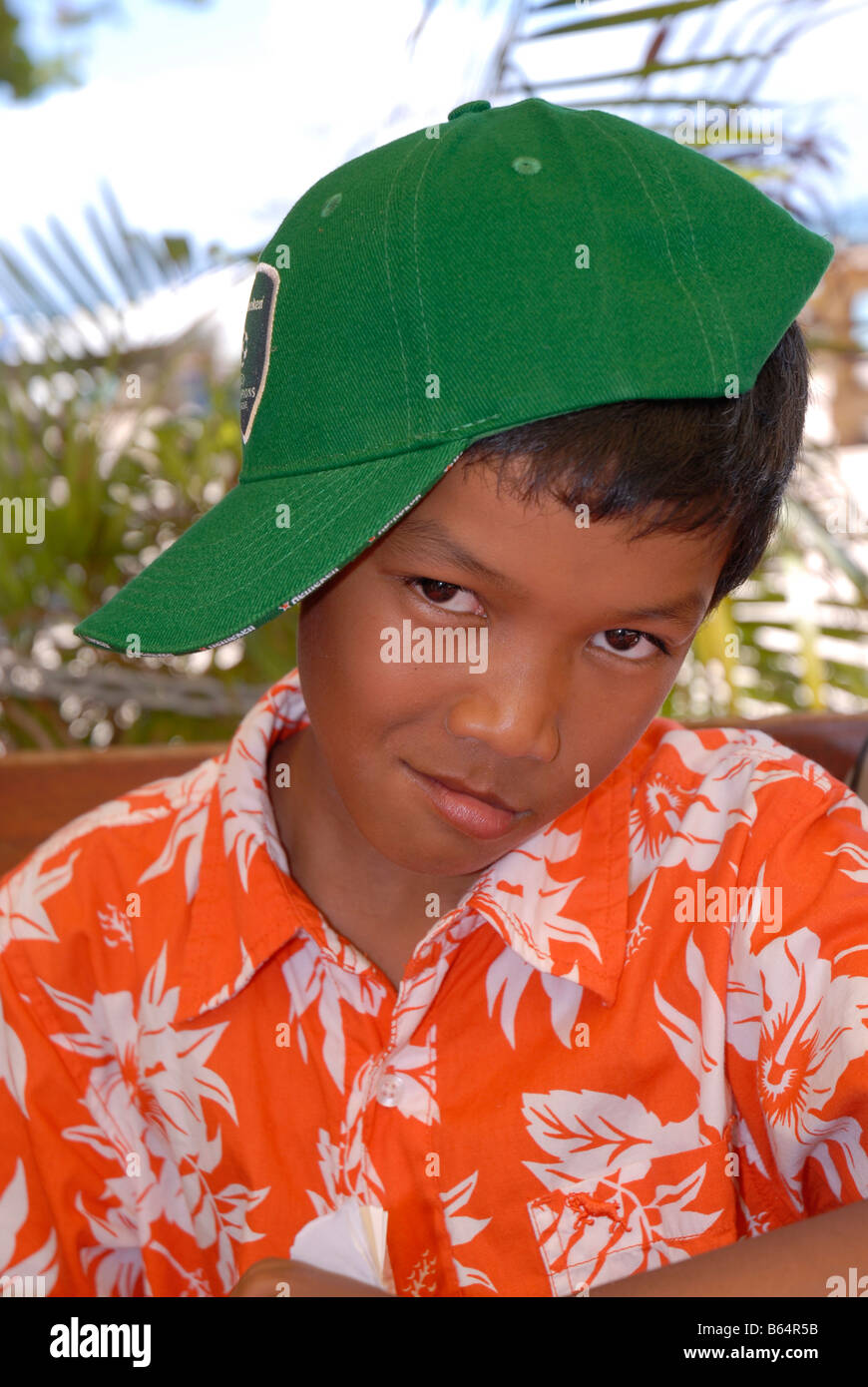 boy make a face with a green cap Stock Photo - Alamy
