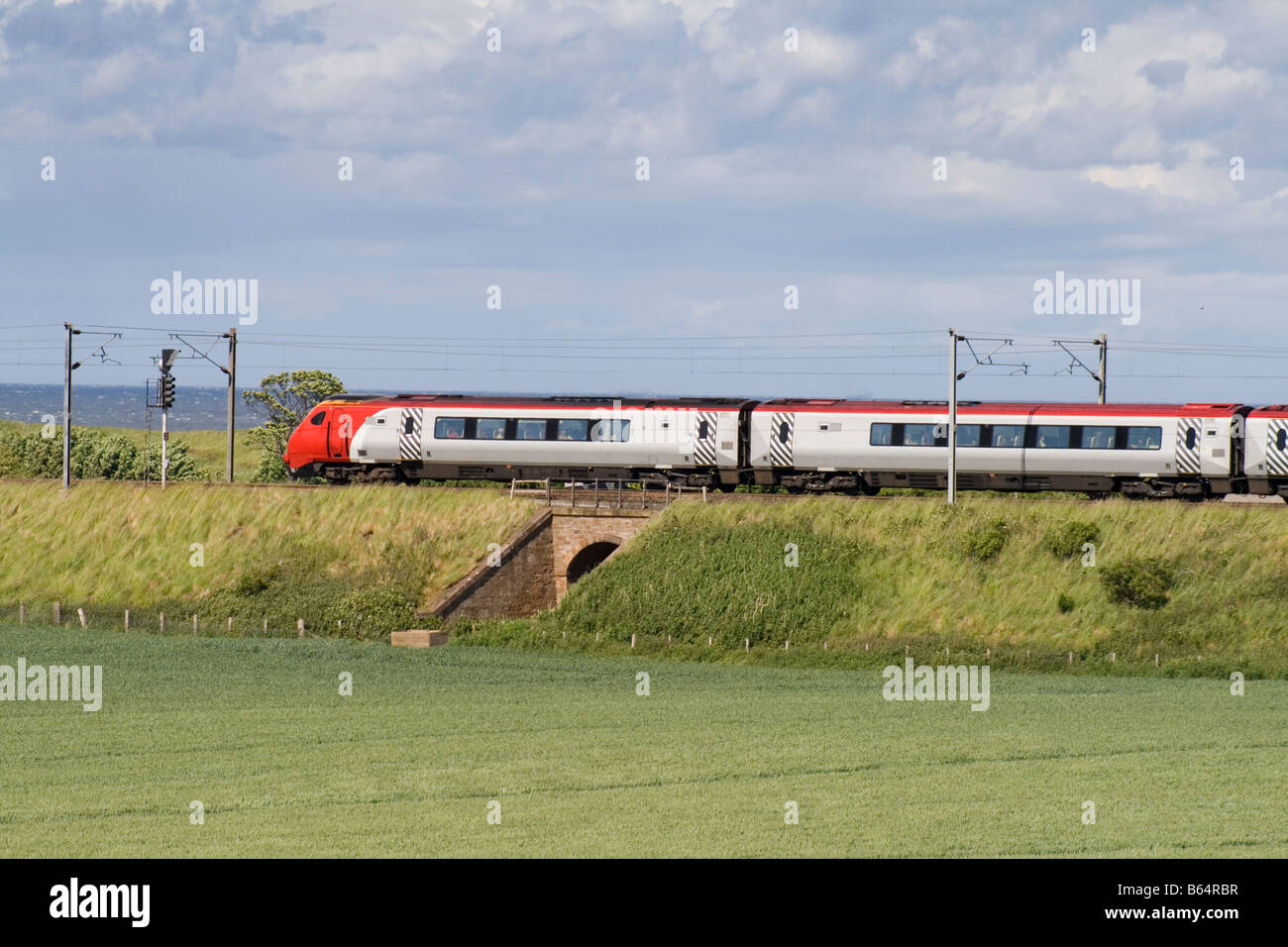 Voyager 221 114 on ECML near Scottish Border, in debadged Virgin livery ...