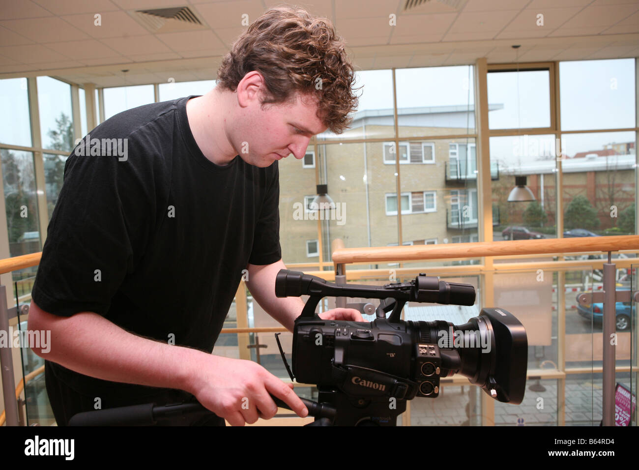 a film camera man filming a modal during a commercial film shoot Stock ...