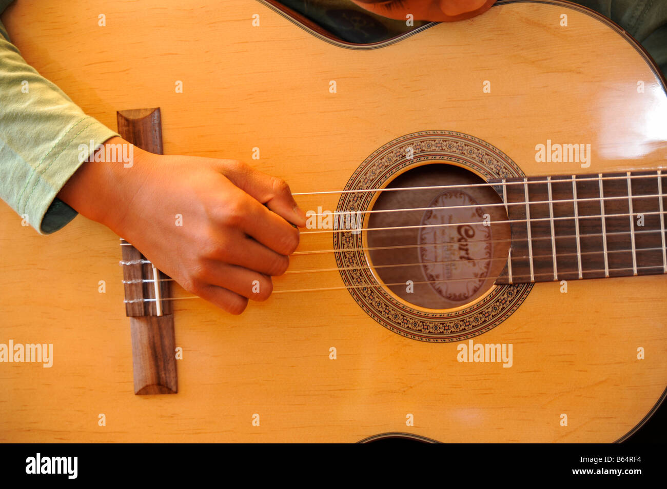 boy play classical guitar Stock Photo - Alamy