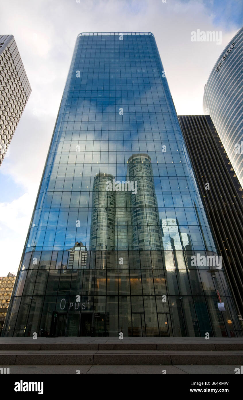 Modern futuristic Sky-scraper reflected in the shiny glass facade of ...