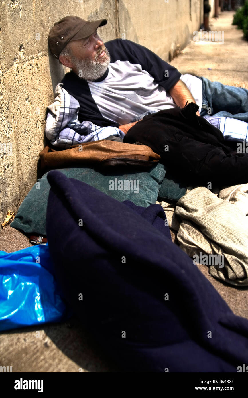 Homeless Man lying on its bed. Brooklyn, NY, USA Stock Photo - Alamy
