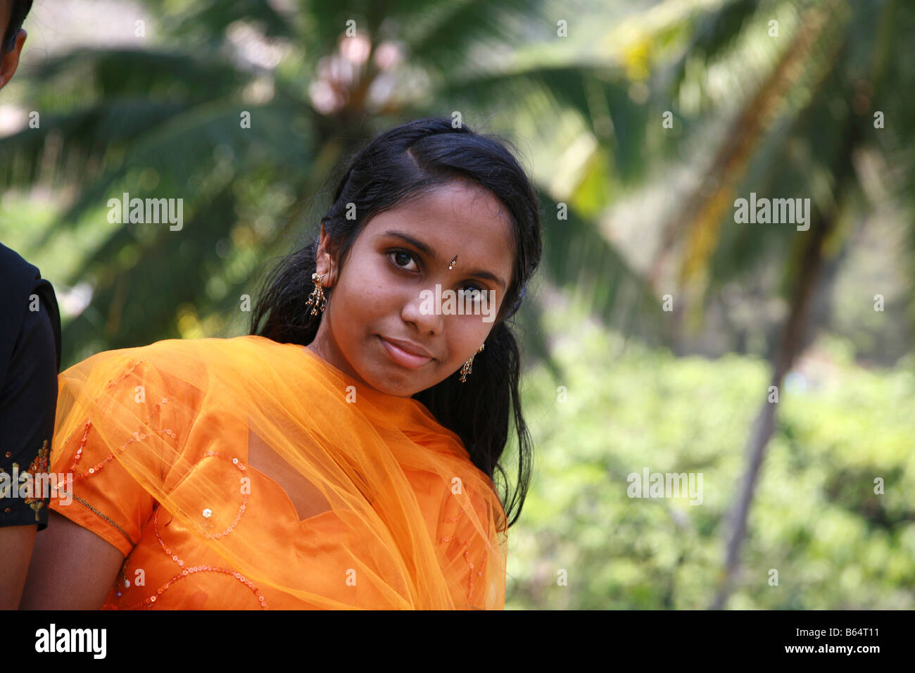 India girl orange sari hi-res stock photography and images - Alamy