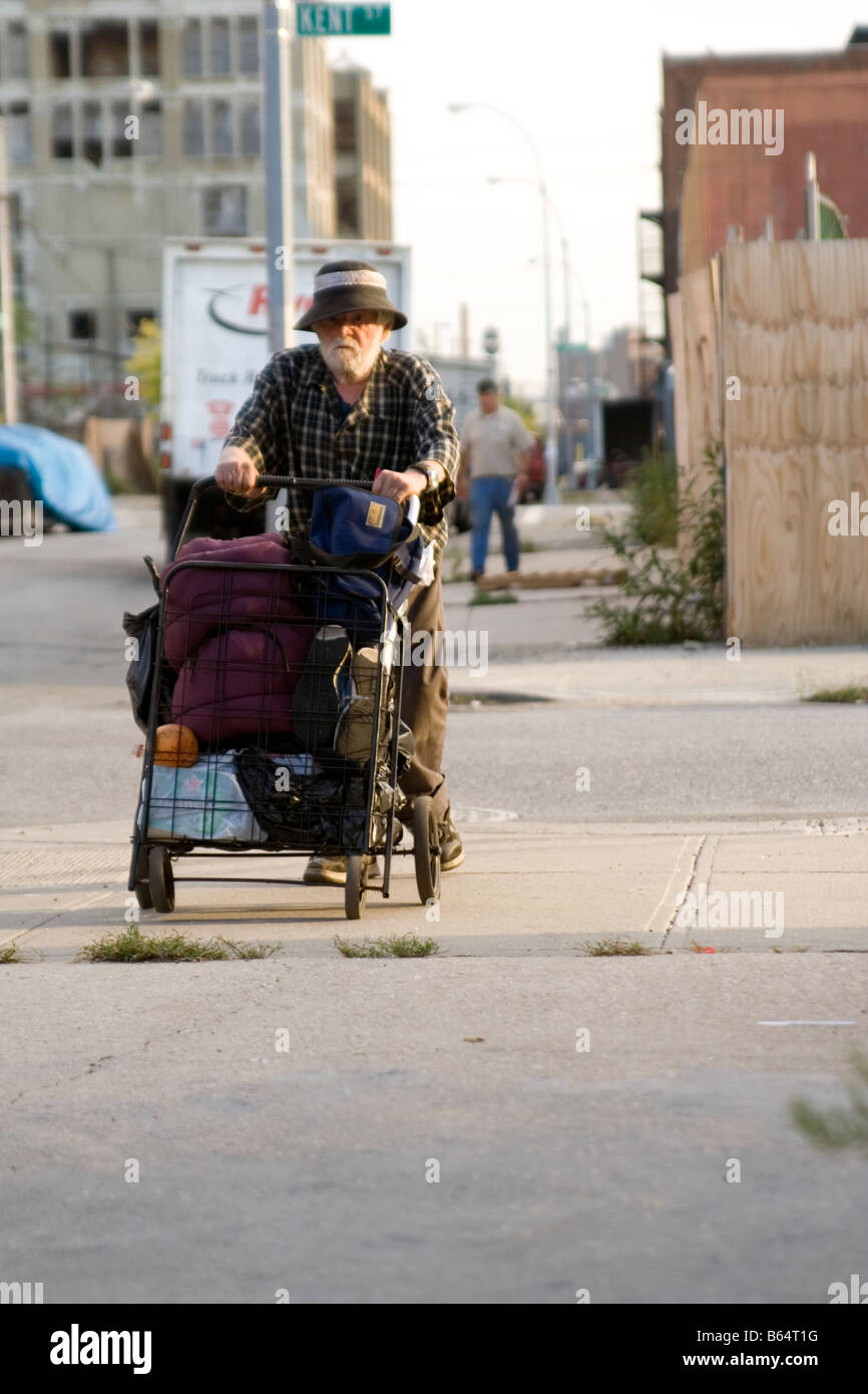 Homeless Man with his cart on street of Brooklyn, NY, USA Stock Photo ...