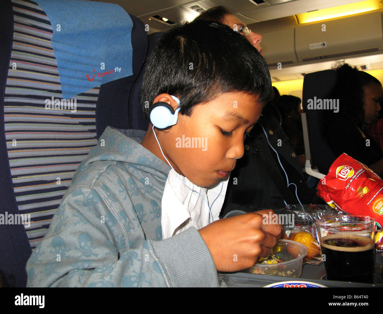 Child airplane eating hi-res stock photography and images - Alamy