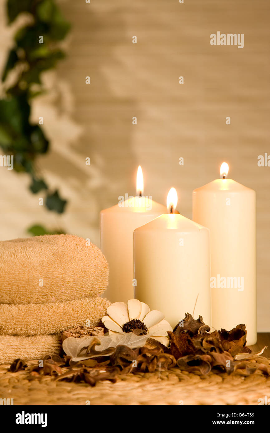 Spa candles with potpourri Stock Photo - Alamy