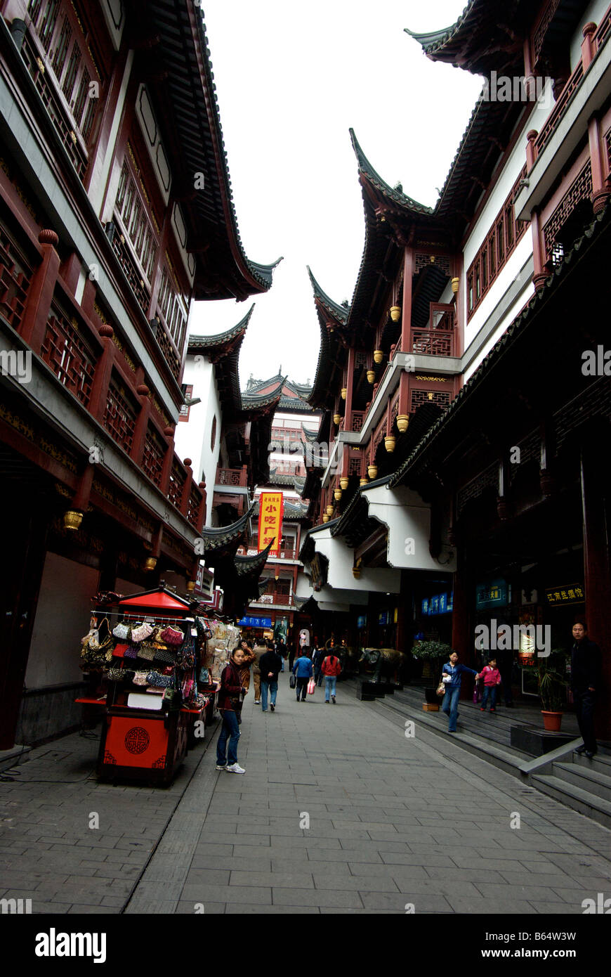 Shops stalls carts selling good and wares in old Chinese architectural ...