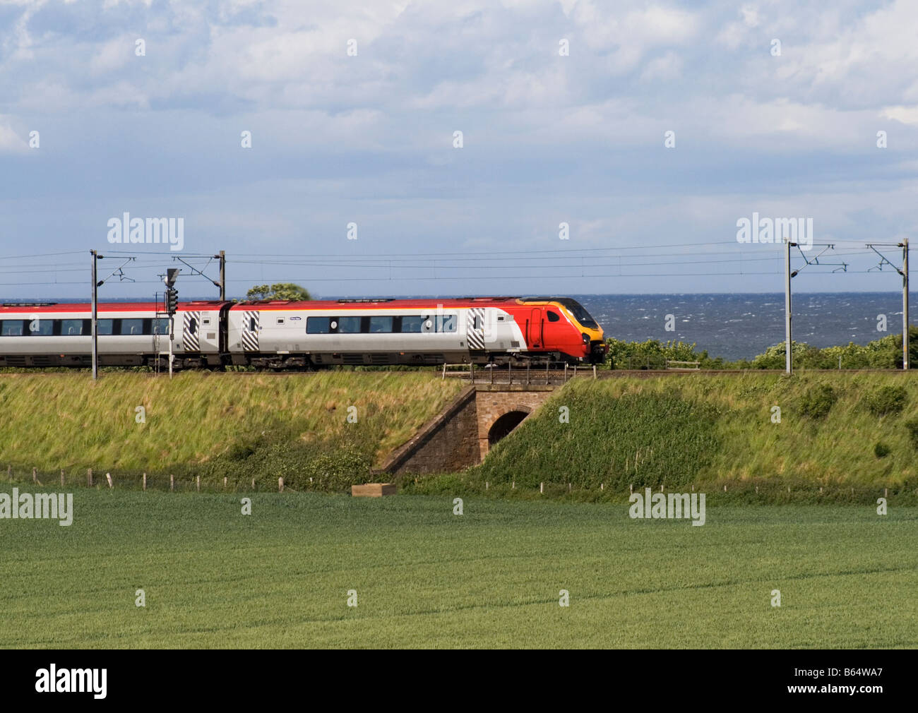 Voyager 221 114 on ECML near Scottish Border, in debadged Virgin livery ...