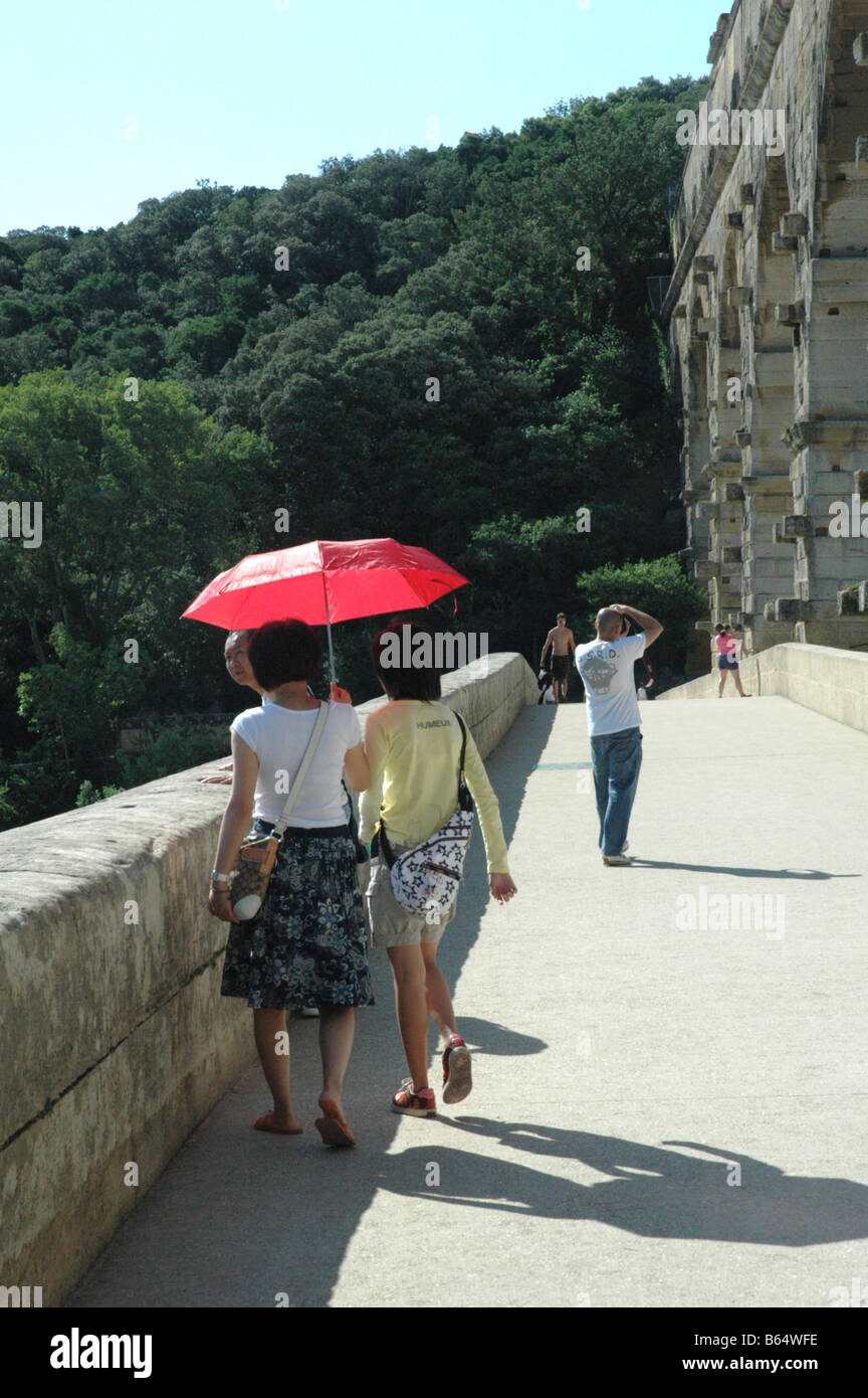 Lady with red umbrella at "Pont du Gard" Roman Aqueduct Stock Photo - Alamy