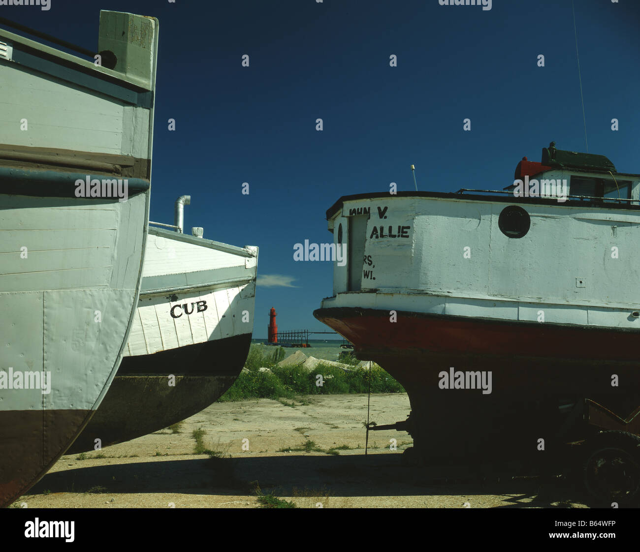 Fishing Boats Framing a Lighthouse Stock Photo - Alamy