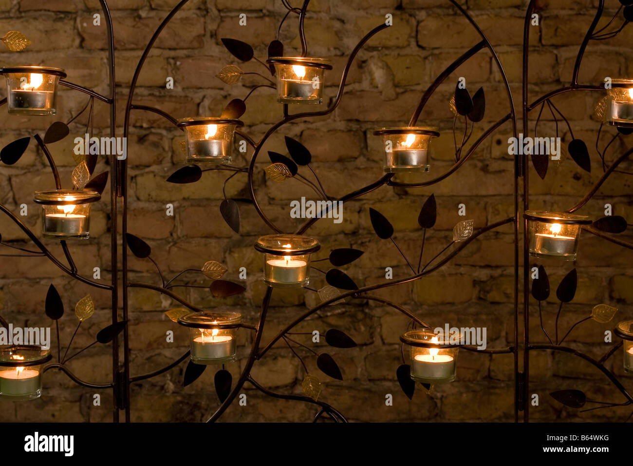 decorative candles with wall background Stock Photo - Alamy