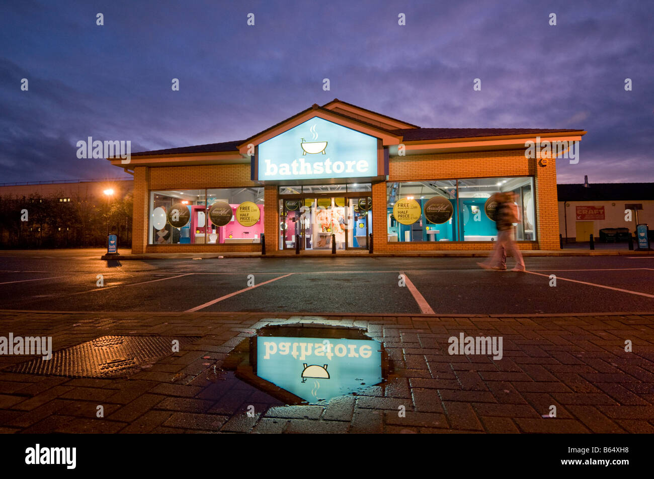 The Bathstore bathroom fittings store in a retail park at night, logo ...