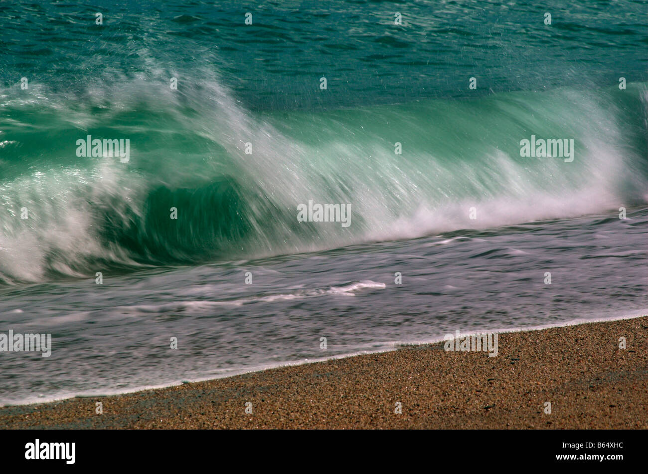 Wave crashing on beach hi-res stock photography and images - Alamy