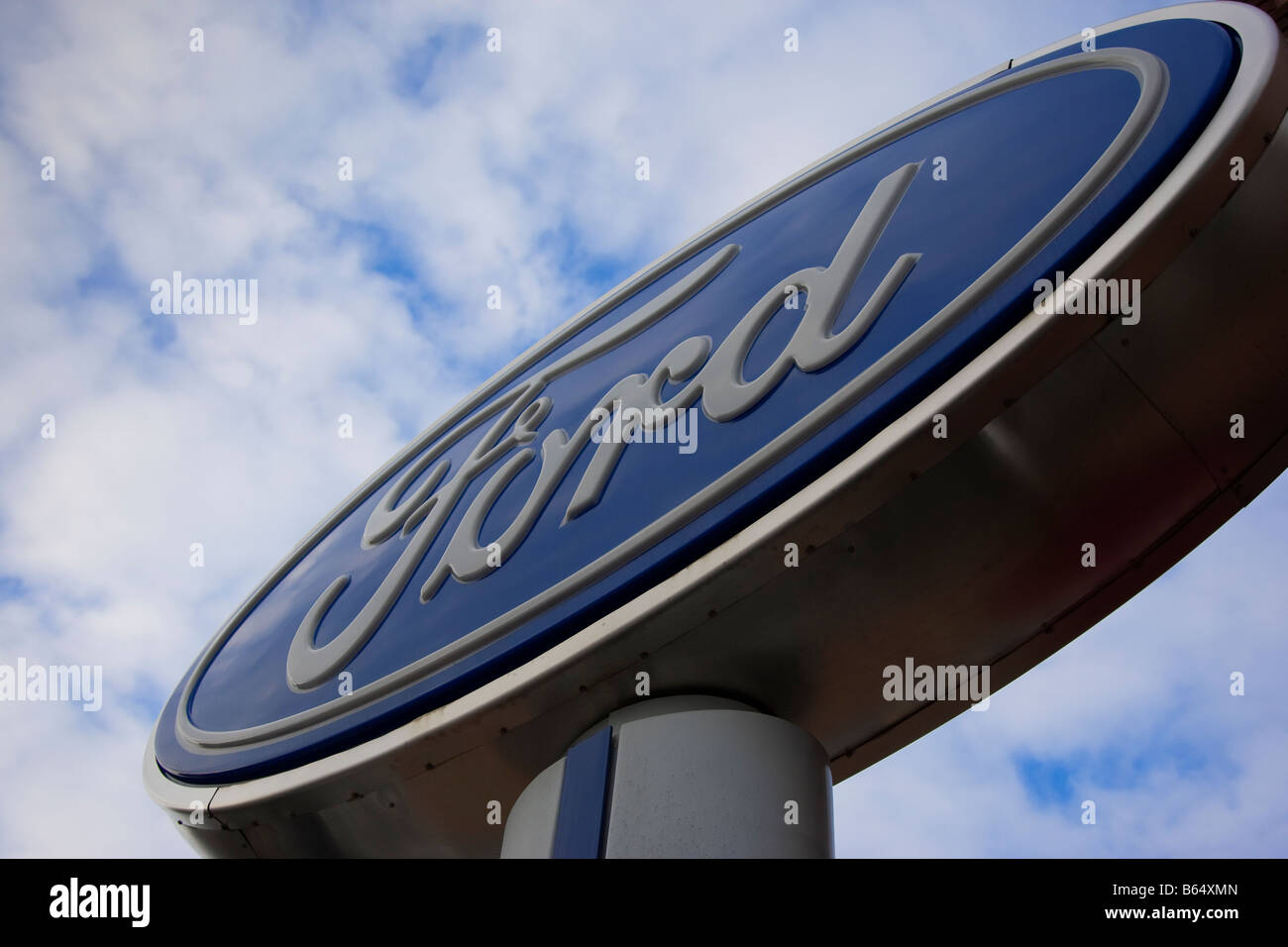 Ford sign above a car dealership Stock Photo - Alamy