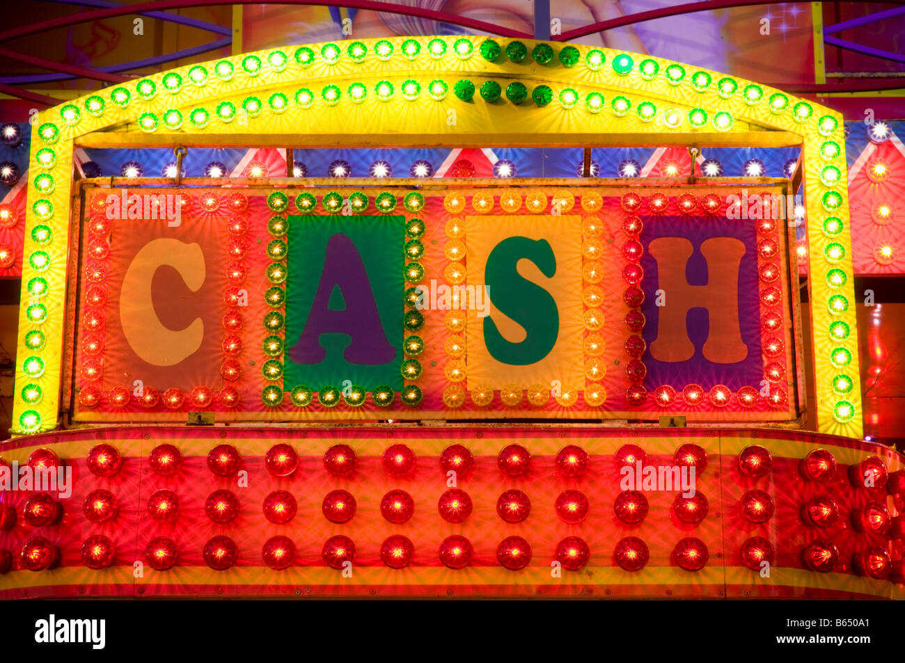brightly lit fairground attraction ride offering cash prizes Stock ...