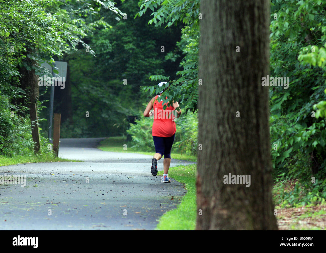 Female lone runner hi-res stock photography and images - Alamy