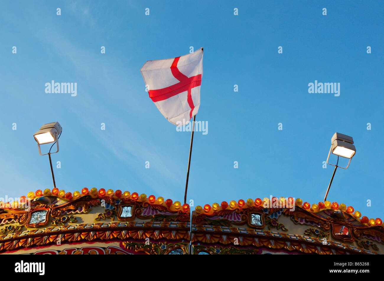 The flag of St George on a merry go round ride at a London fair Stock ...