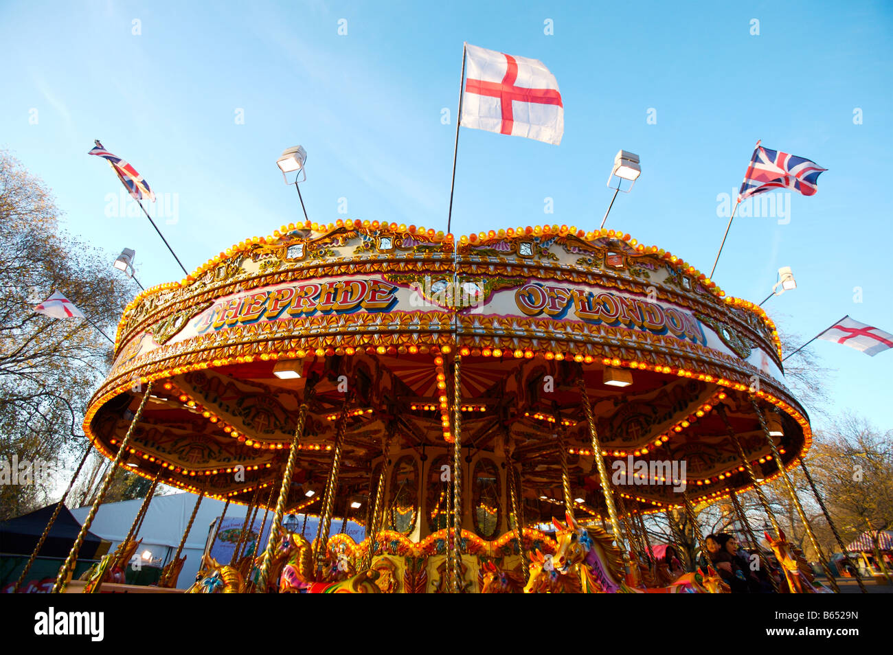 A merry go round ride at the fair Stock Photo - Alamy