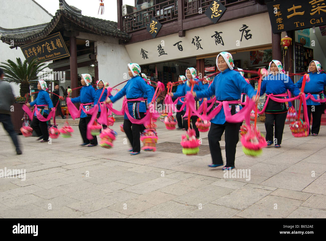 Street performers in costume dancing traditional folk dance in motion ...