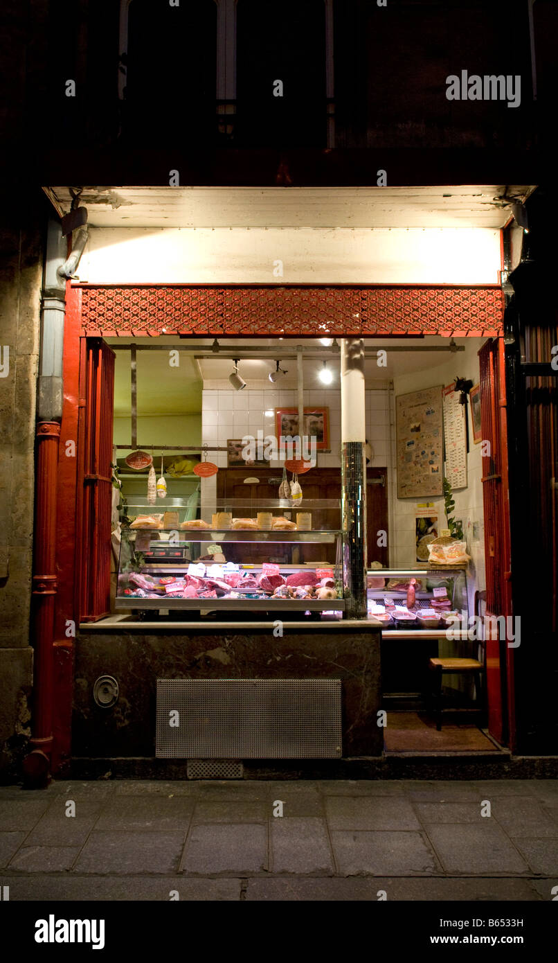 Butcher shop in Paris at night-time Stock Photo - Alamy
