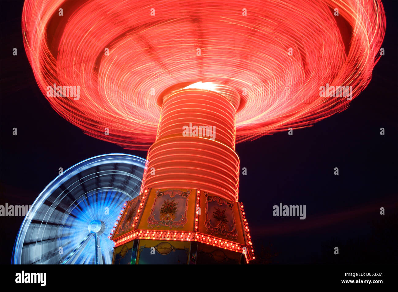 A Carousel and Ferris Wheel at Winter Wonderland, London Stock Photo ...
