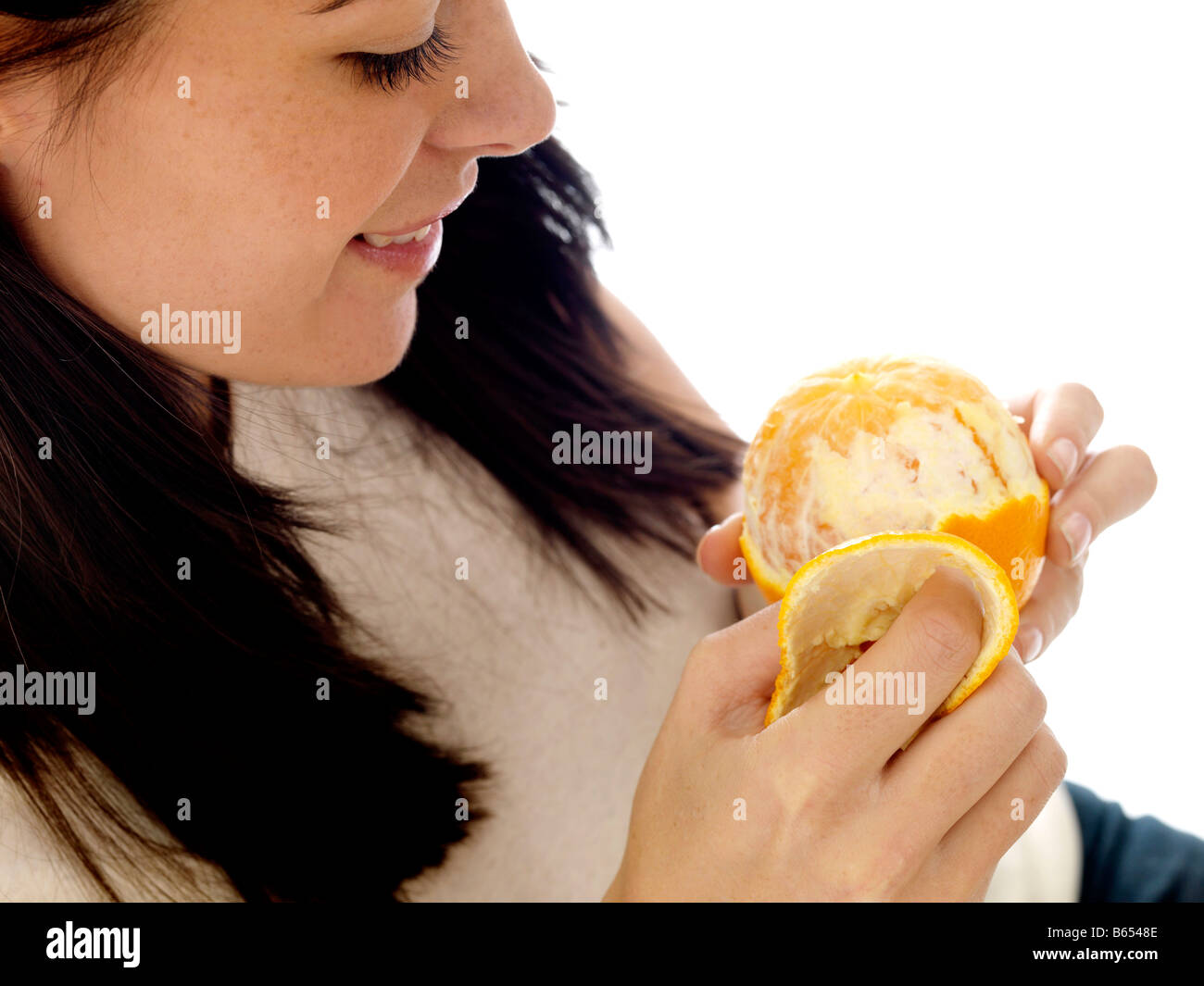 Woman Peeling An Orange Model Released Stock Photo - Alamy