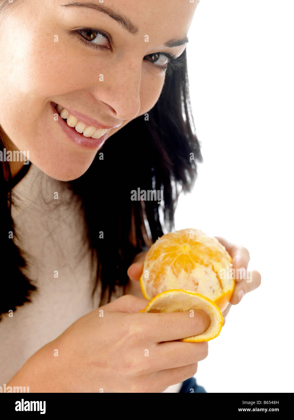 Woman Peeling An Orange Model Released Stock Photo - Alamy
