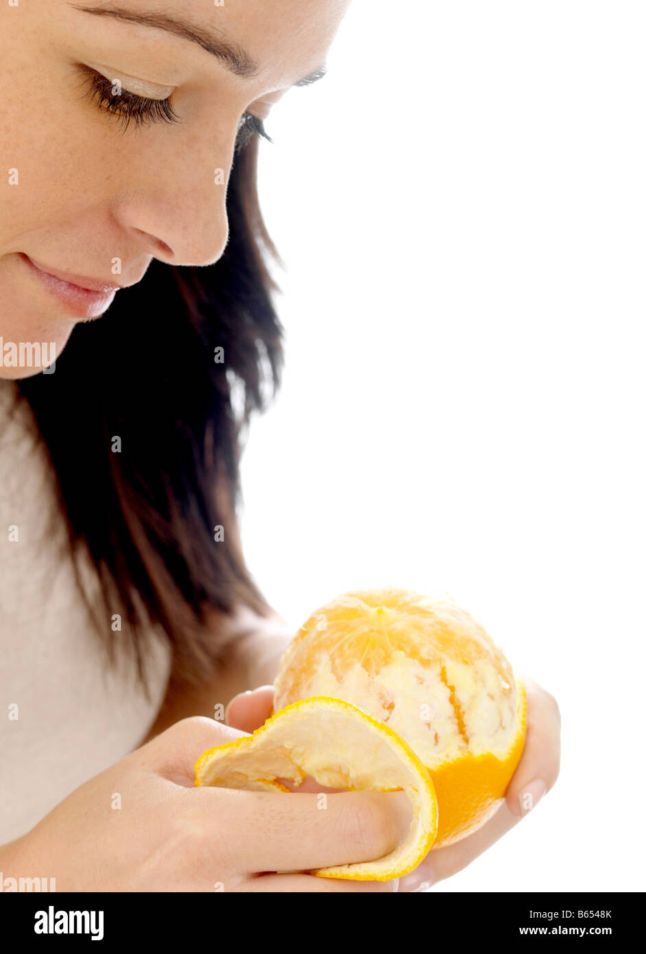 Woman Peeling An Orange Model Released Stock Photo - Alamy