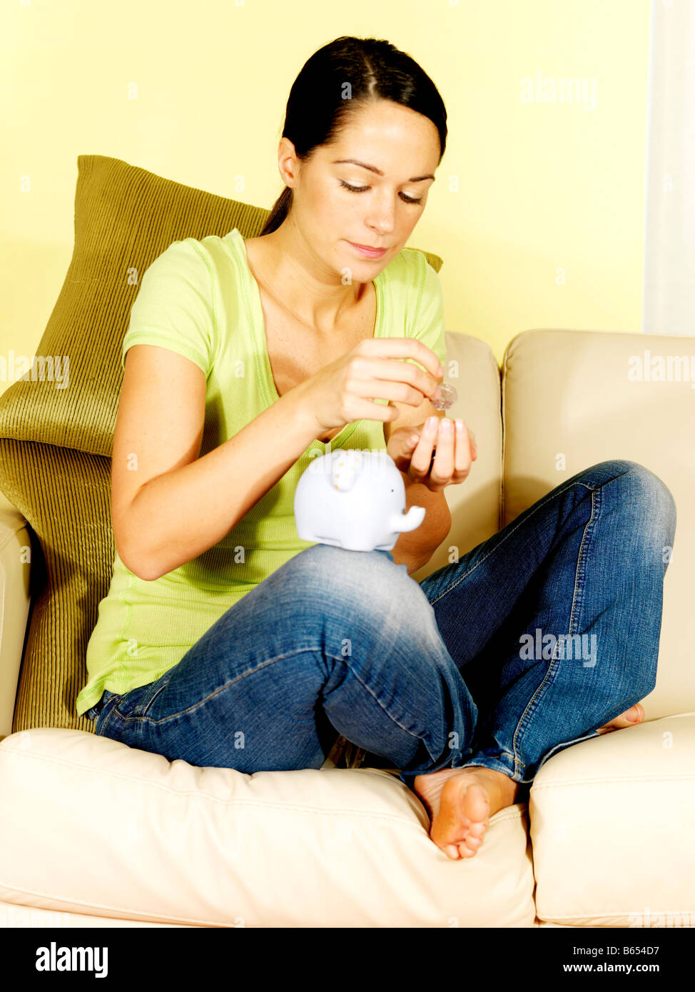 Young Woman Saving Money Model Released Stock Photo - Alamy