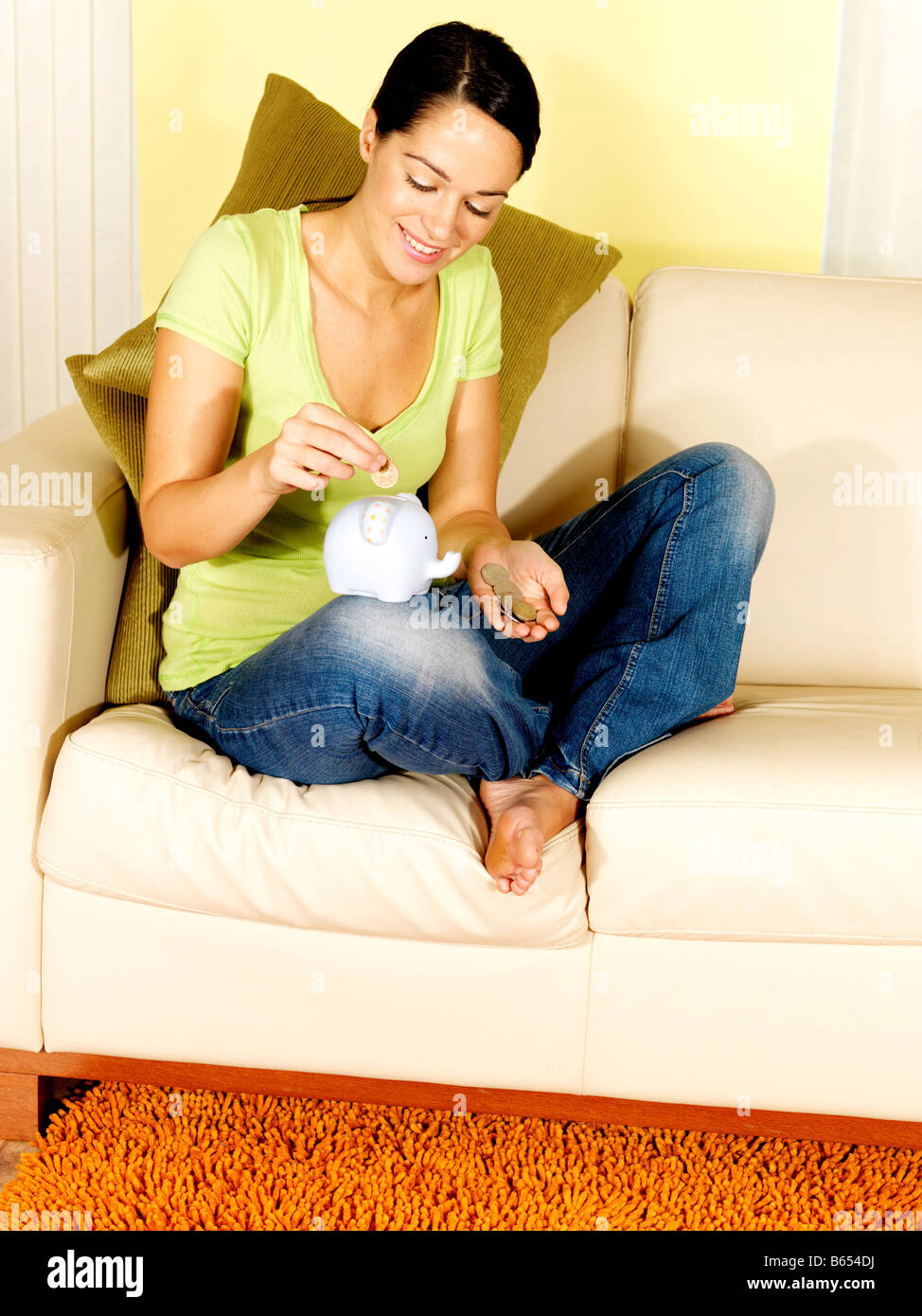 Young Woman Saving Money Model Released Stock Photo - Alamy
