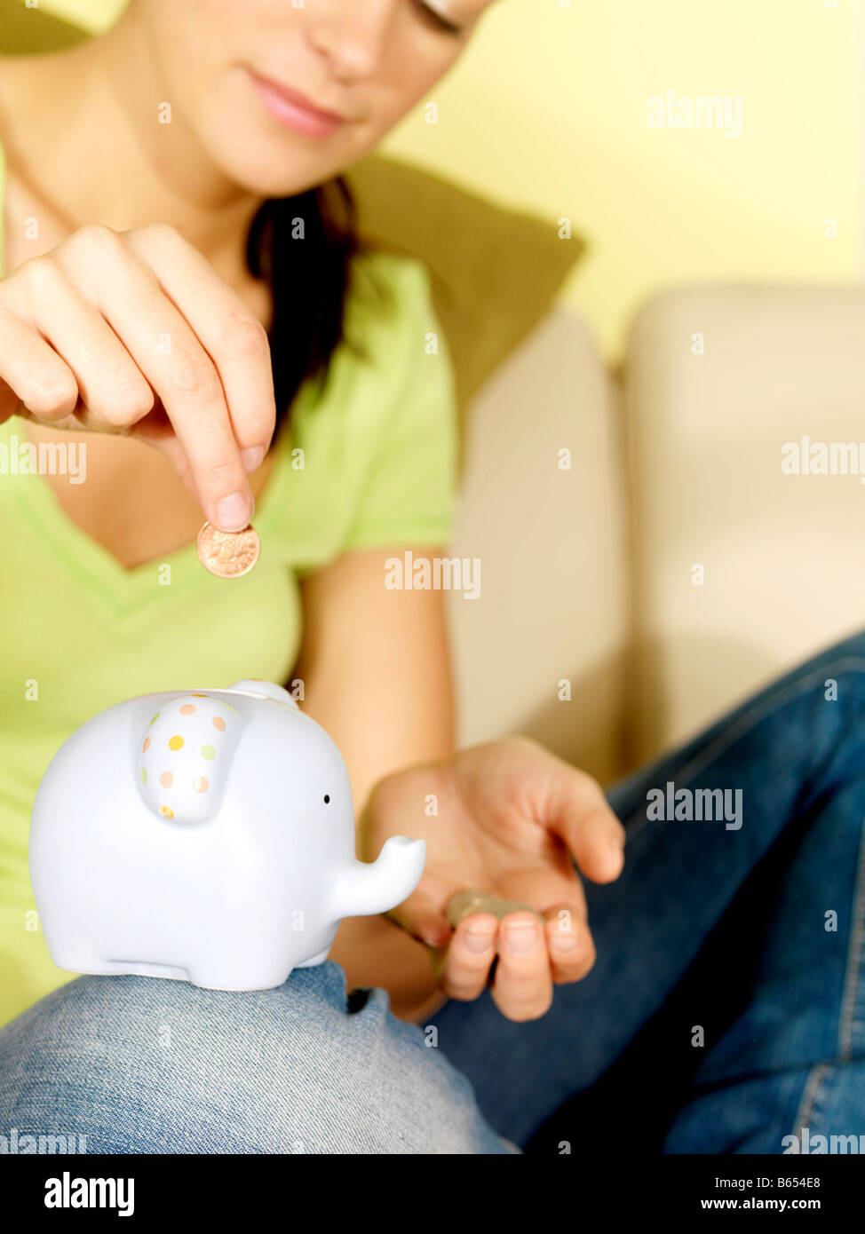 Young Woman Saving Money Model Released Stock Photo - Alamy