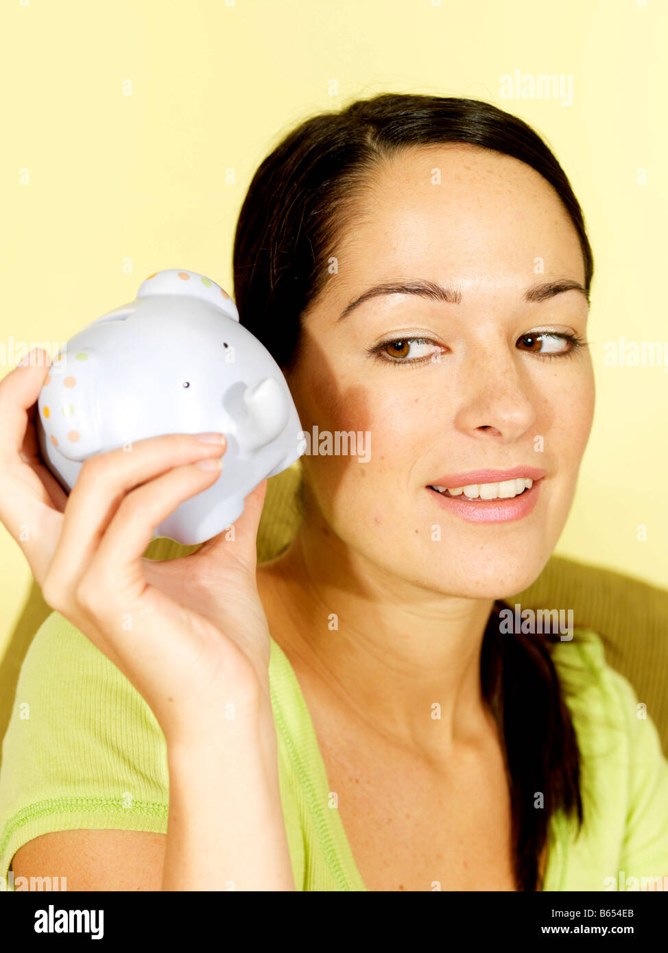 Young Woman Saving Money Model Released Stock Photo - Alamy
