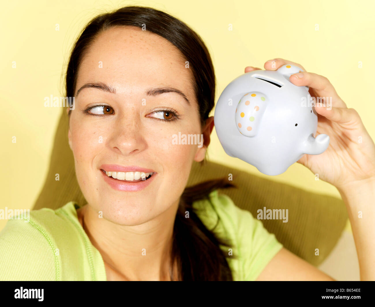 Young Woman Saving Money Model Released Stock Photo - Alamy