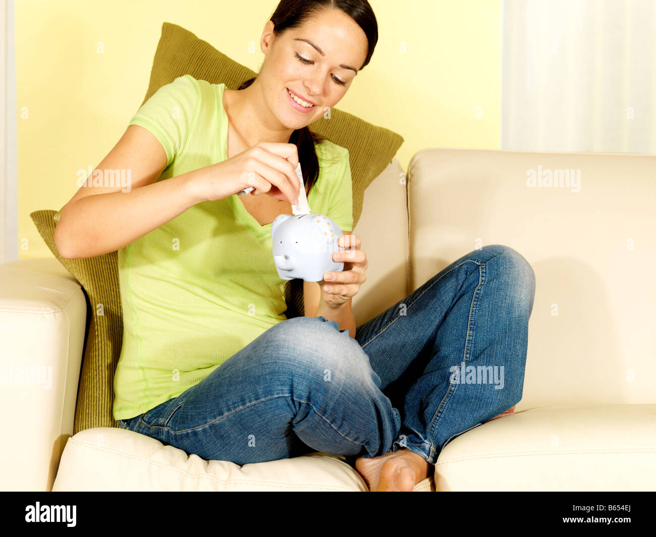 Young Woman Saving Money Model Released Stock Photo - Alamy