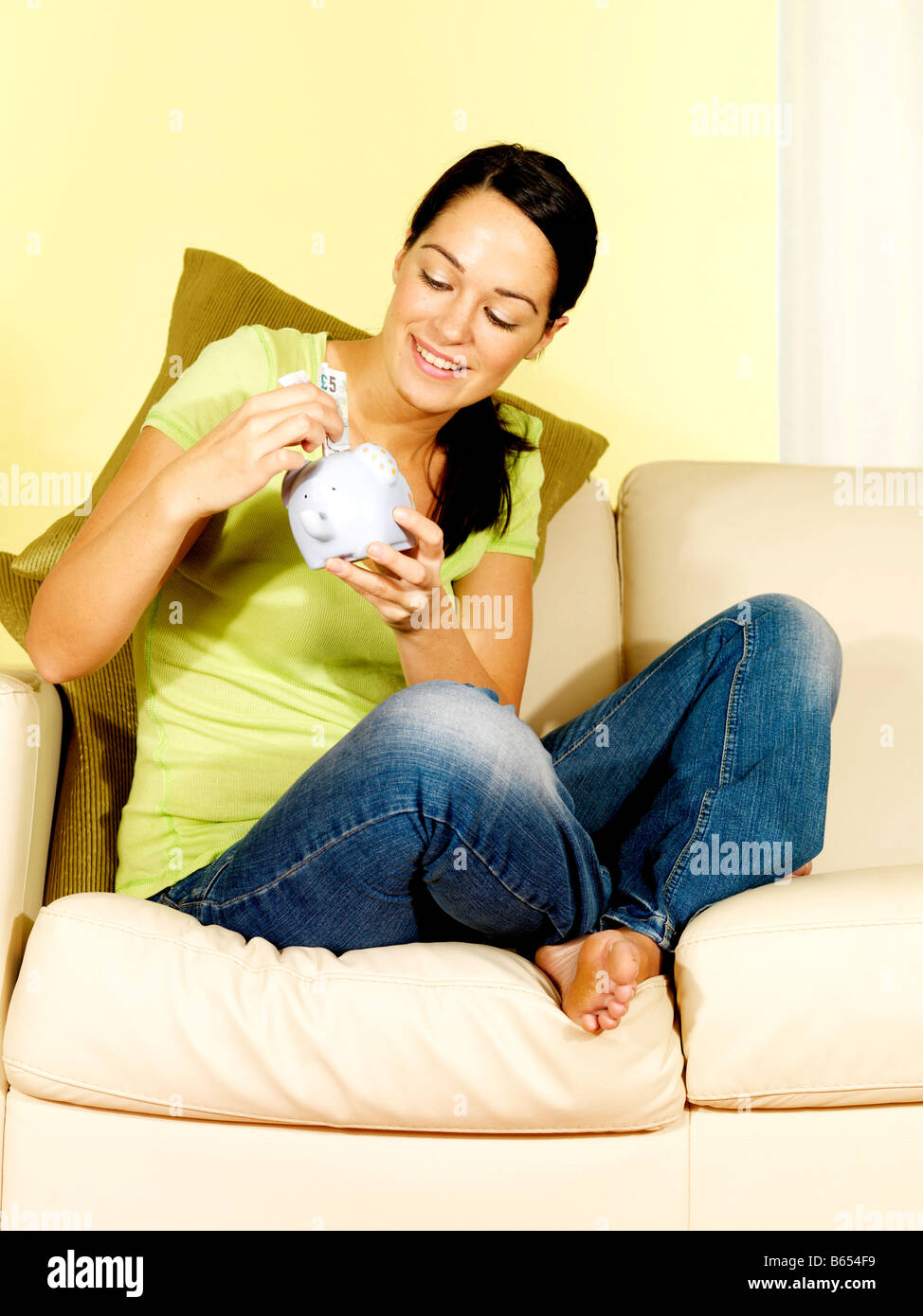 Young Woman Saving Money Model Released Stock Photo - Alamy