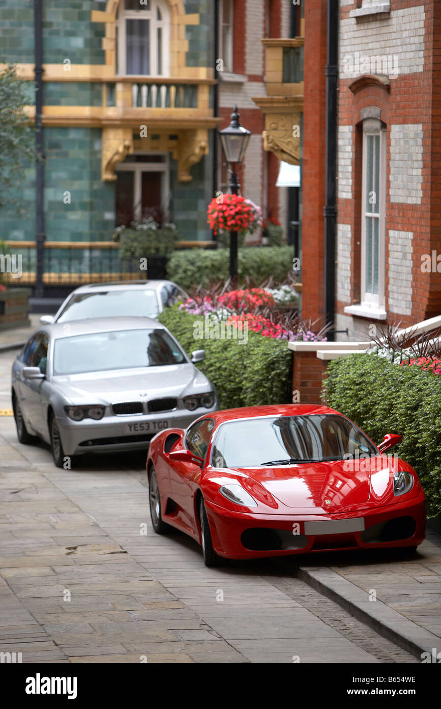 London Ferrari F430 and BMW 7 series parked up in trendy London strret ...